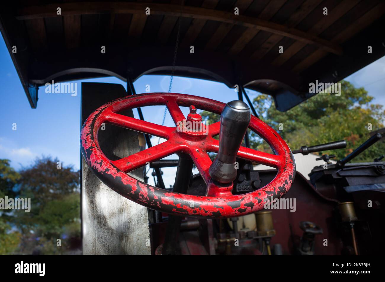 Close up of a red vintage traction steam engine steering wheel Stock ...
