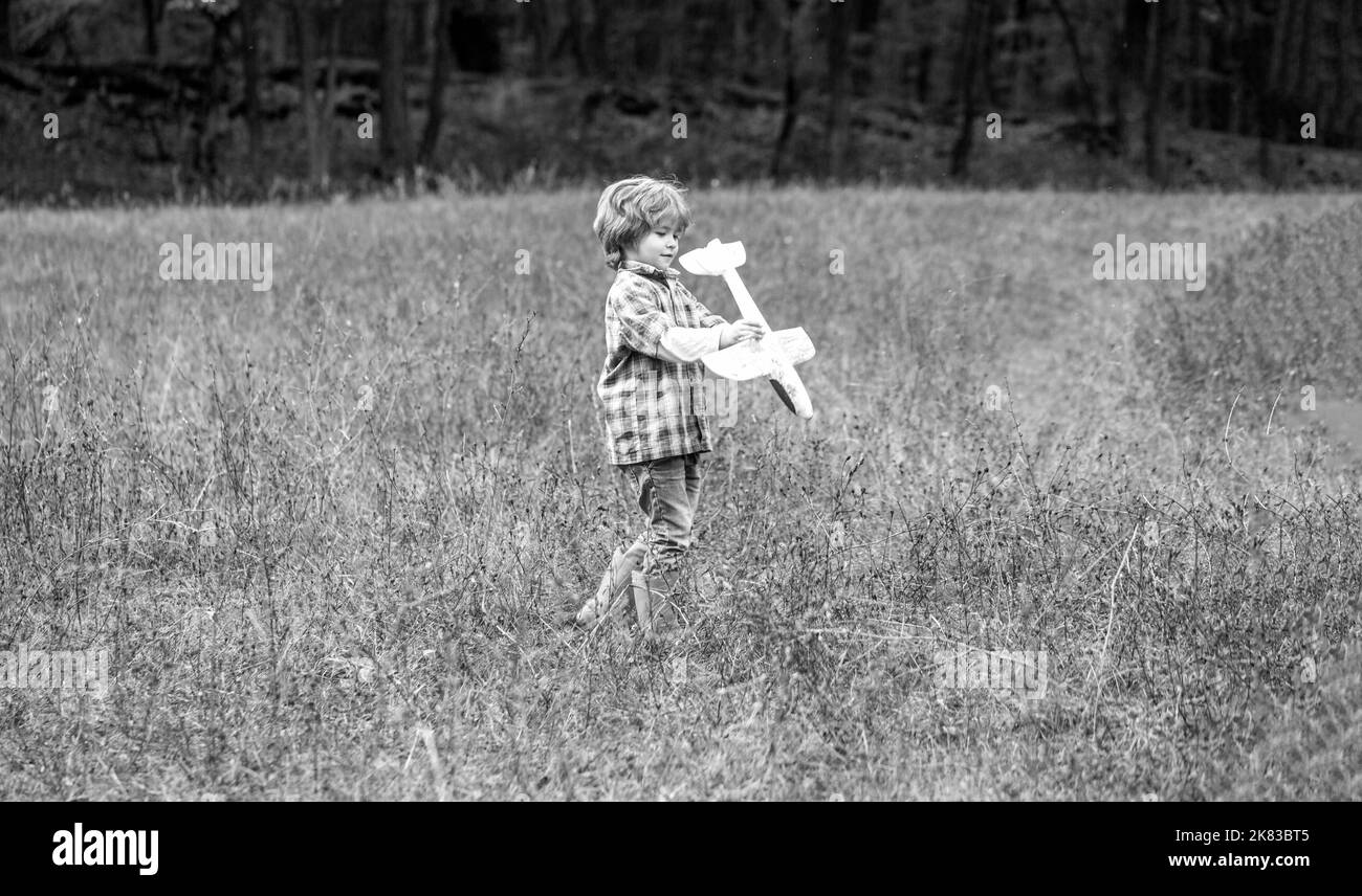 Little boy with plane. Little kid dreams of being a pilot. Child ...