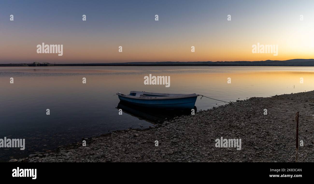 Beautiful sunset over Lake Budeasa in central Romania with a wooden ...
