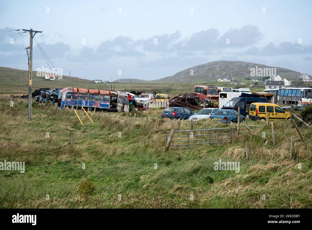 Abandoned vehicles rusting in a field at Eoligarry on the Isle of Barra ...