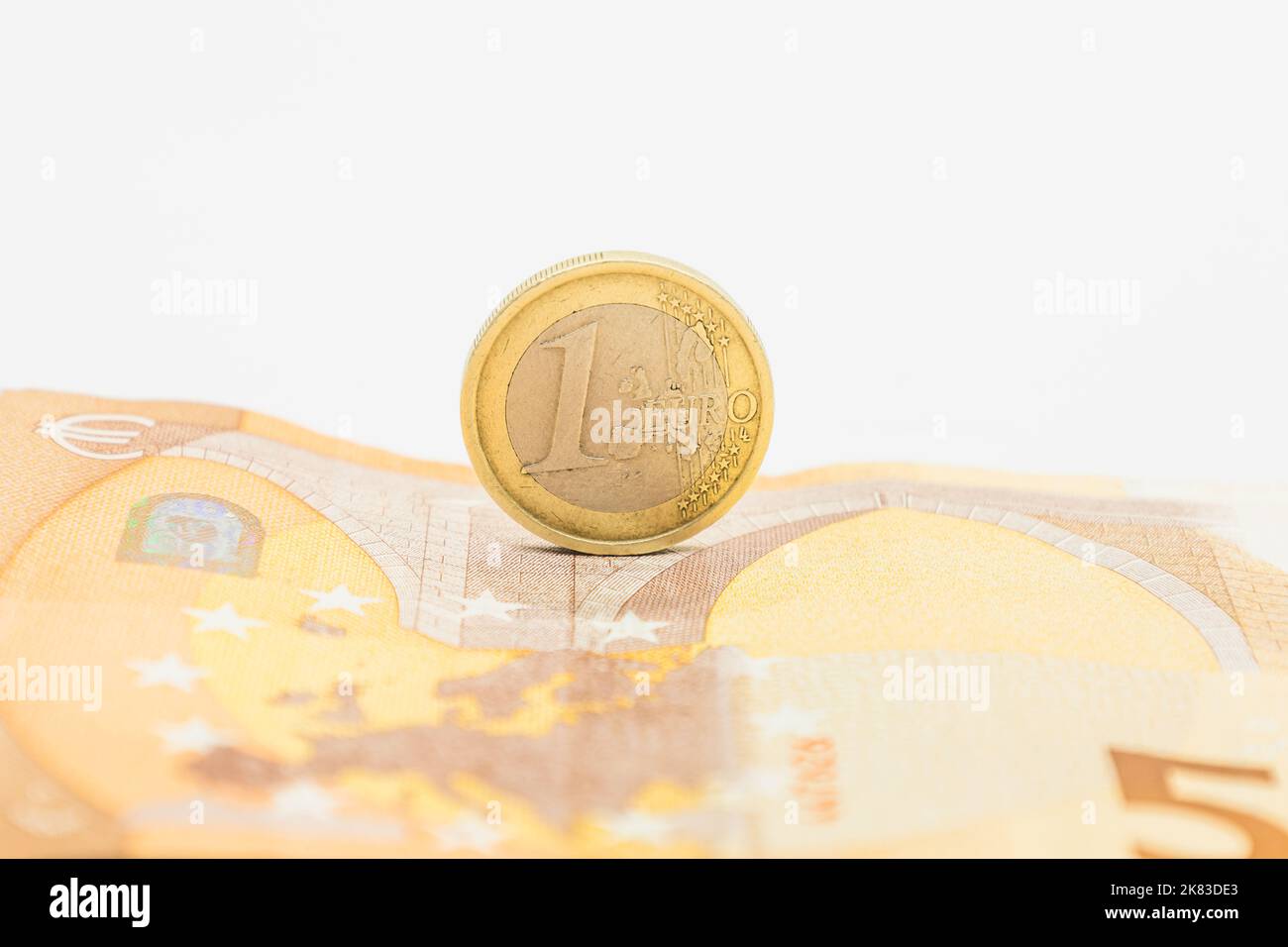 One Euro coin on the fifty Euro note banknote Stock Photo - Alamy