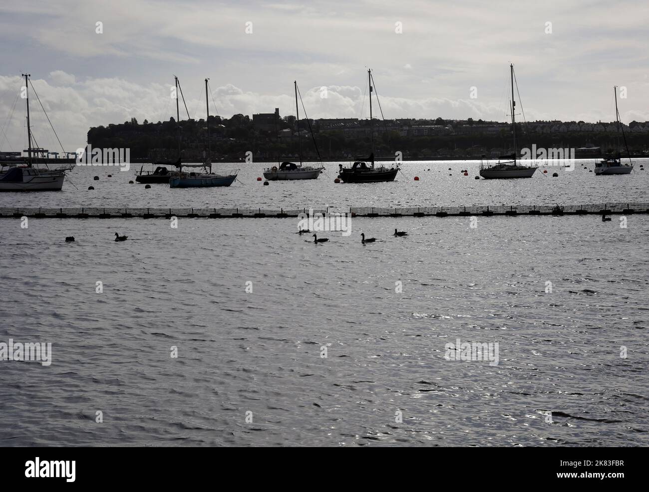 Cardiff Bay. October 2022. Contra jour shot of Penarth head across ...