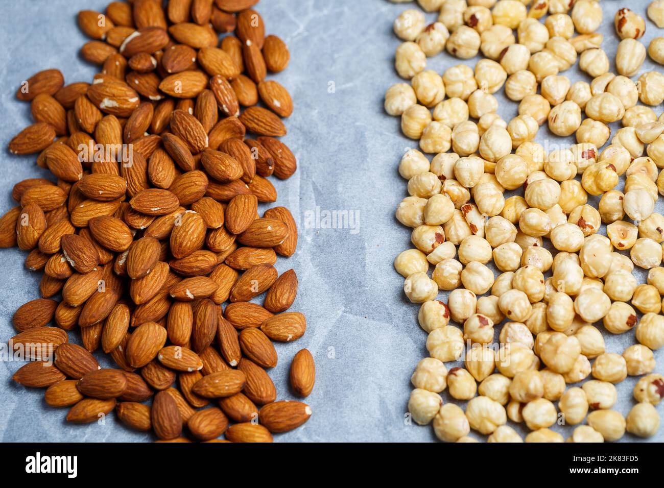 Roasted delicious nuts almonds and hazelnuts on a white background ...