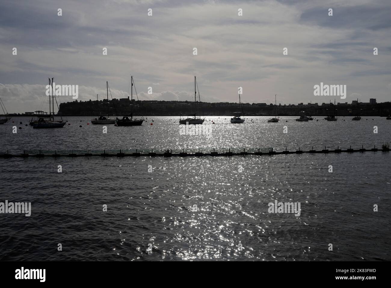 Cardiff Bay. October 2022. Contra jour shot of Penarth head across ...