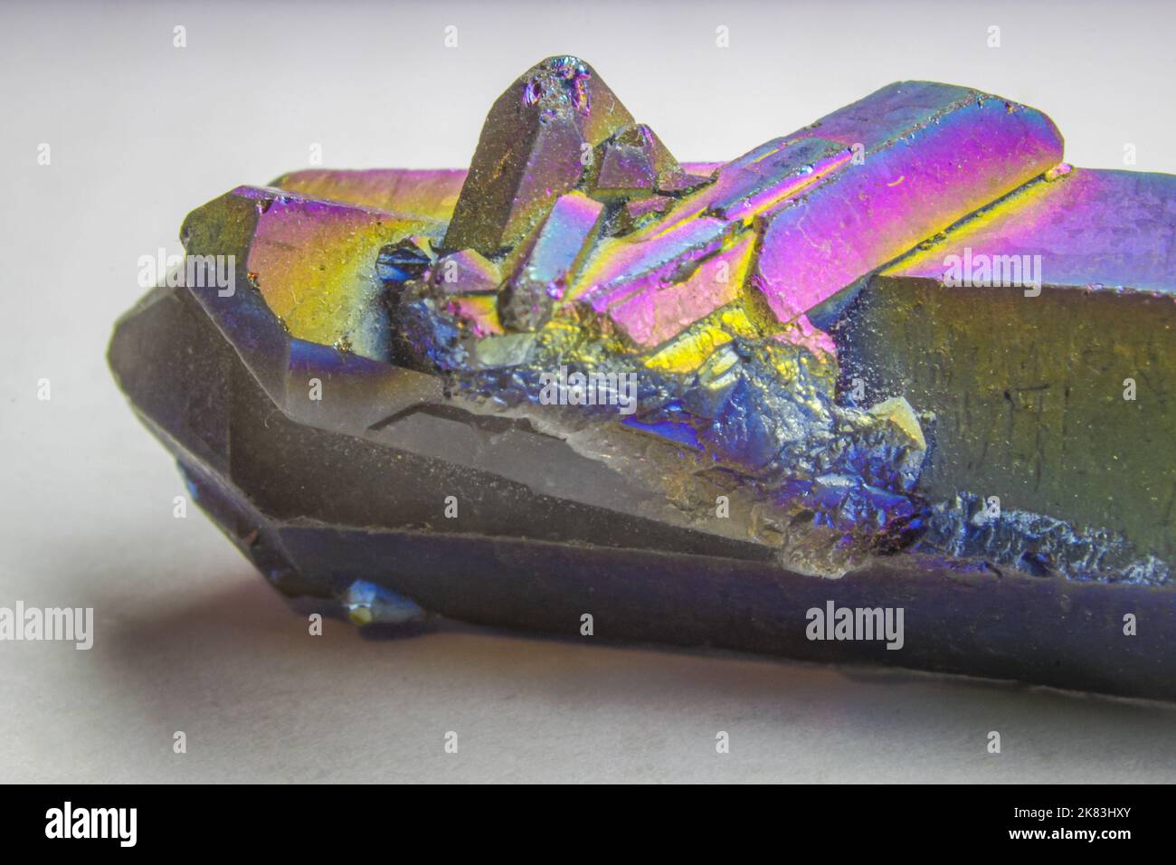 Titanium aura quartz double terminated point with a small cluster ...