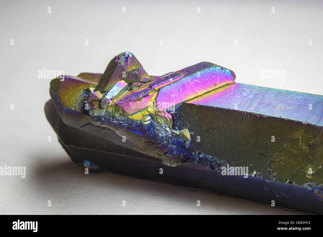 Titanium aura quartz double terminated point with a small cluster ...