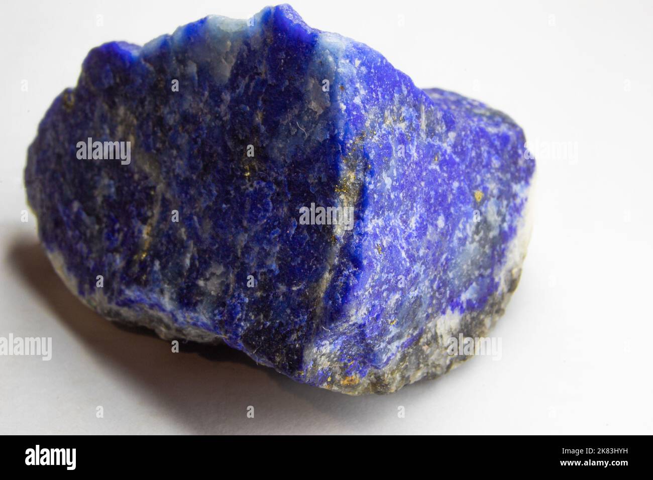 Raw Lapis lazuli rock on white background. Unpolished chunk of lapis ...
