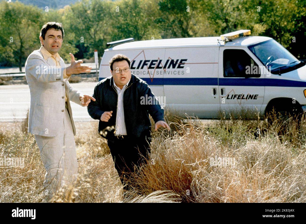 Rowan Atkinson & Wayne Knight Film: Rat Race (2001) Characters: Enrico Pollini & Zack Mallozzi ...