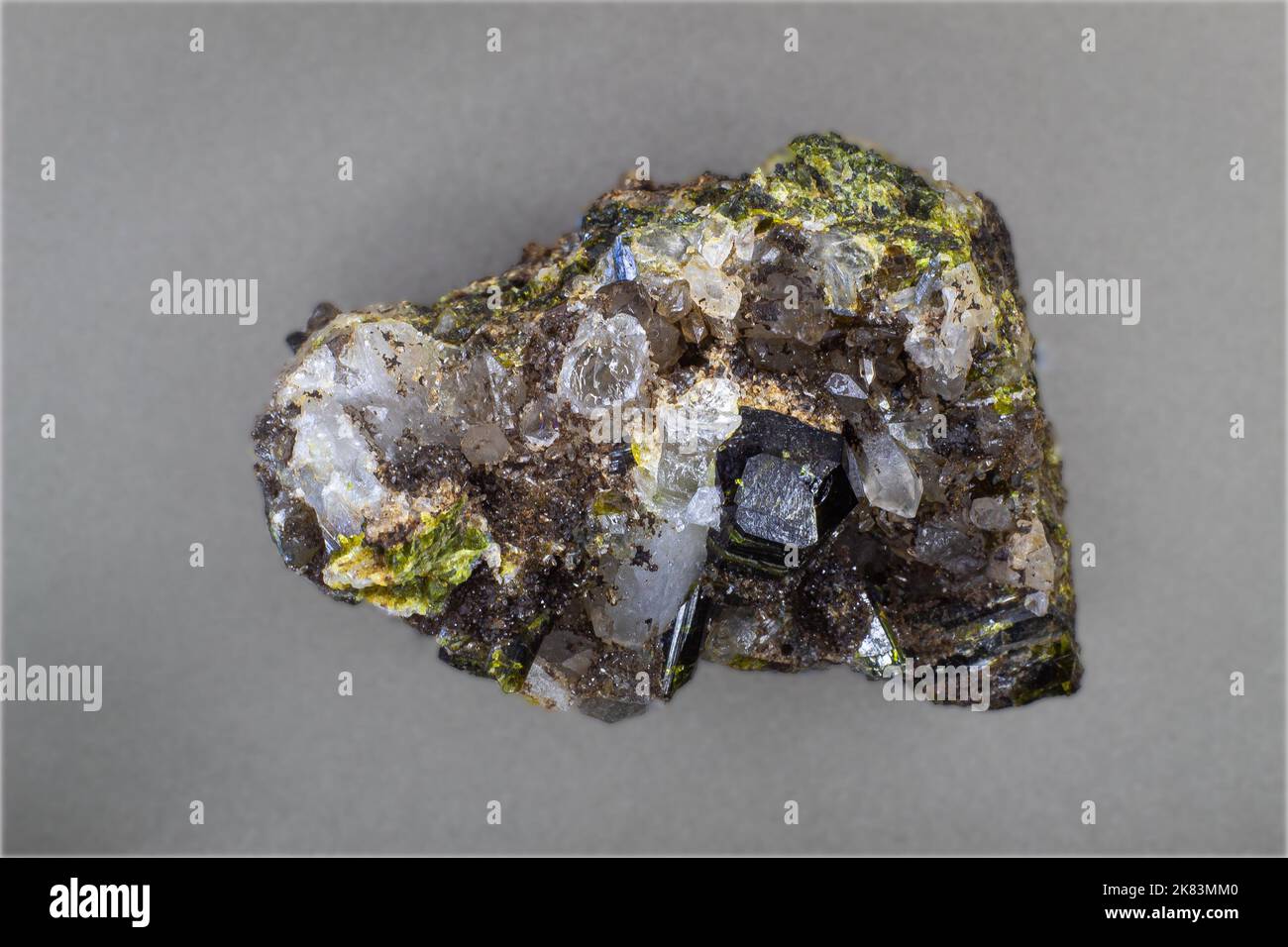 Ultra macro picture of small quartz points with one dark green epidote ...