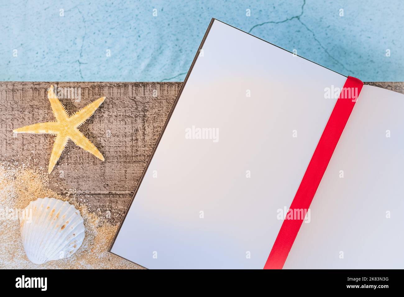 Open book without inscription seen from above on a wooden pavement ...