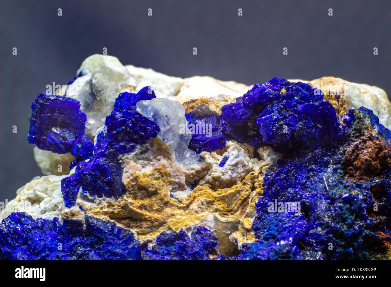 Macro blue azurite cluster on white matrix isolated crystal on black ...