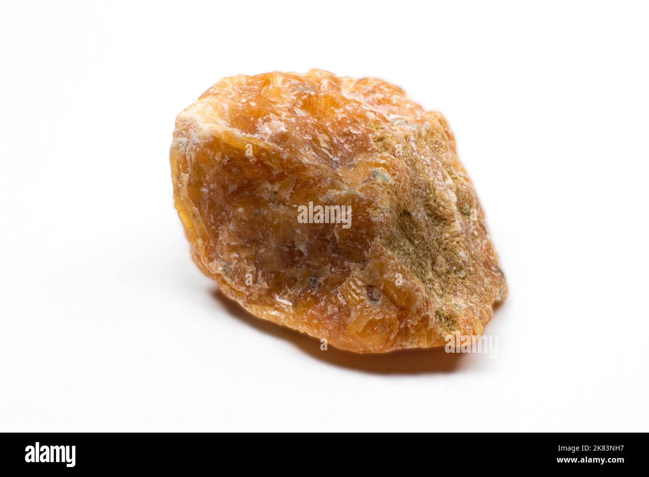 Raw orange calcite stone macro isolated on white background Stock Photo ...
