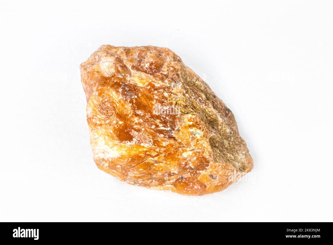 Raw orange calcite stone macro isolated on white background Stock Photo ...