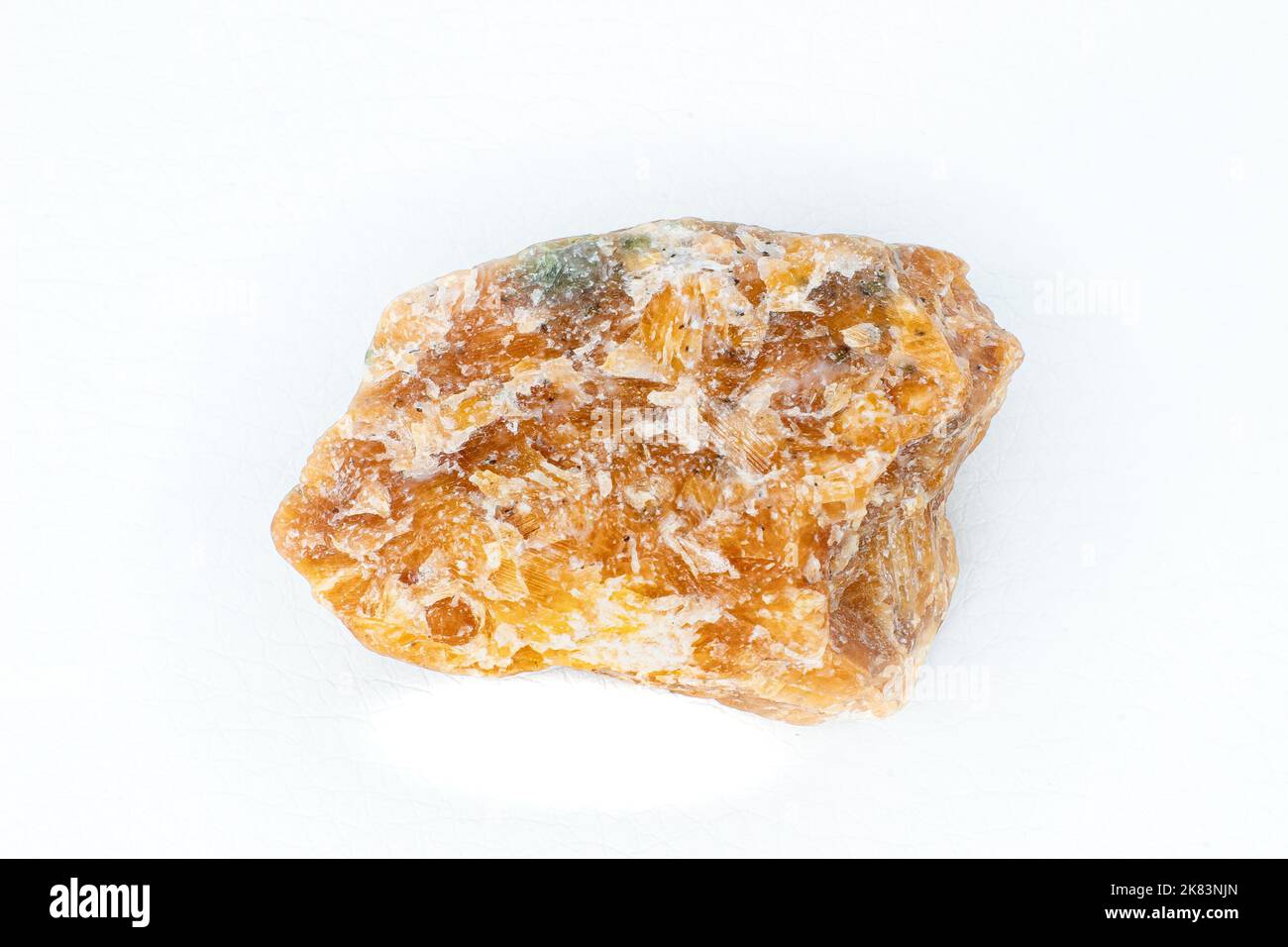 Raw orange calcite stone macro isolated on white background Stock Photo ...