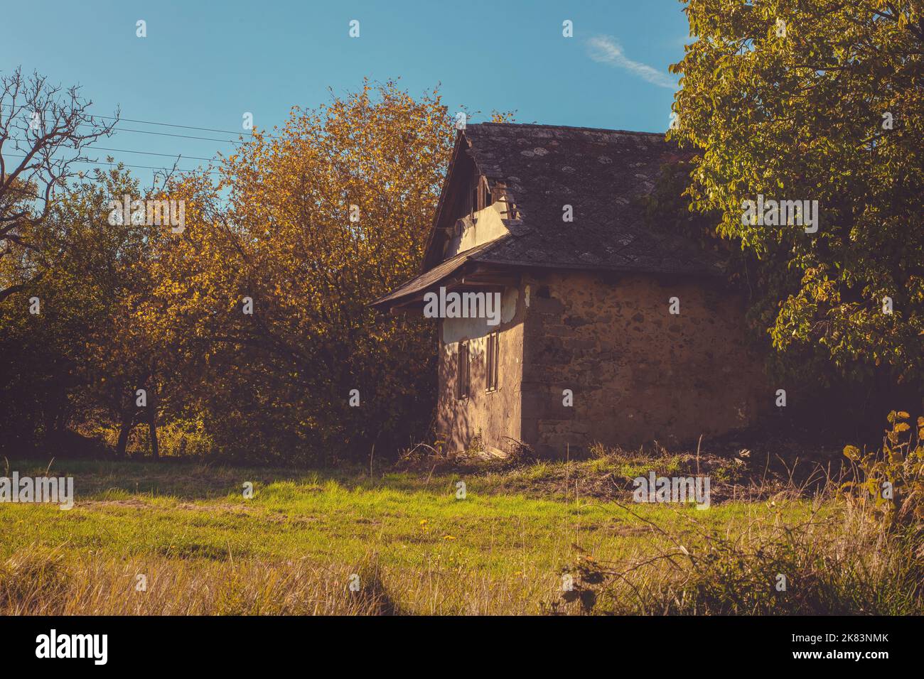 Old peasant house in beautiful natural surroundings.Sunny day in autumn ...