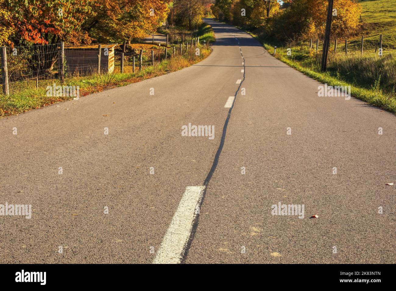 Country road in beautiful natural surroundings.Autumn season. High ...
