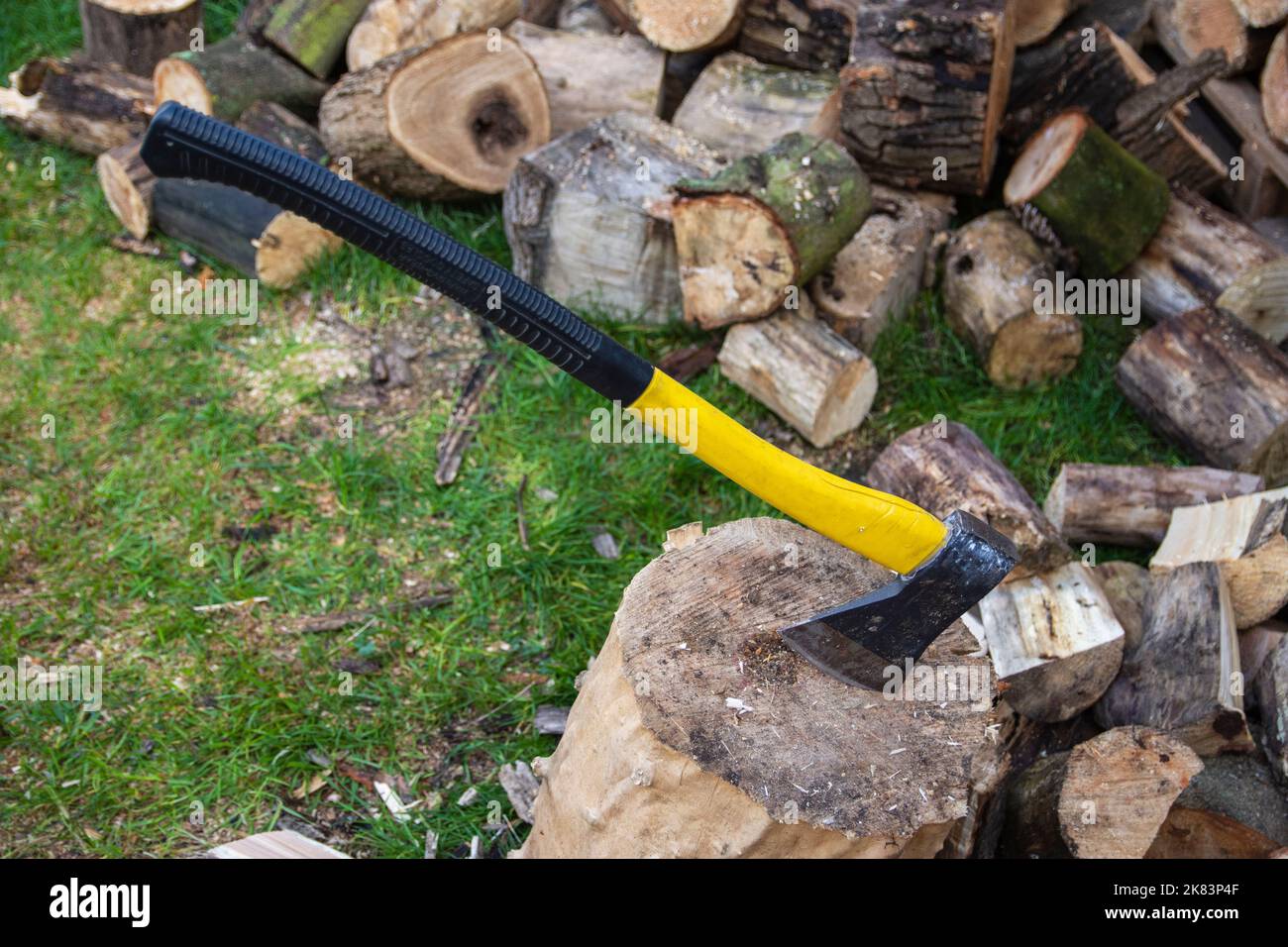 An ax and a stump while chopping firewood on a clear day Stock Photo ...