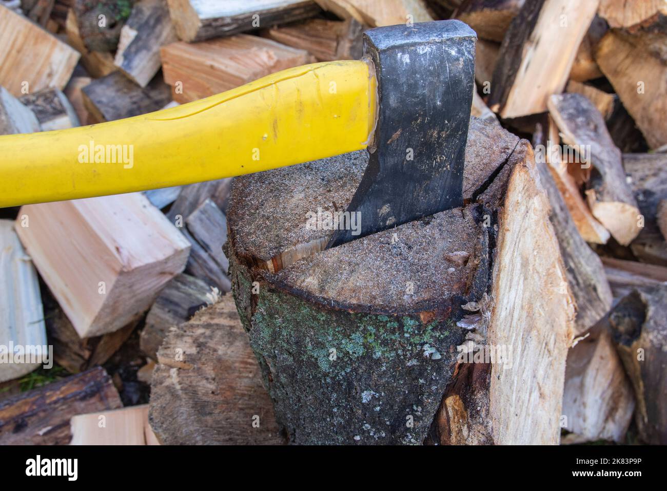An ax and a stump while chopping firewood on a clear day Stock Photo ...