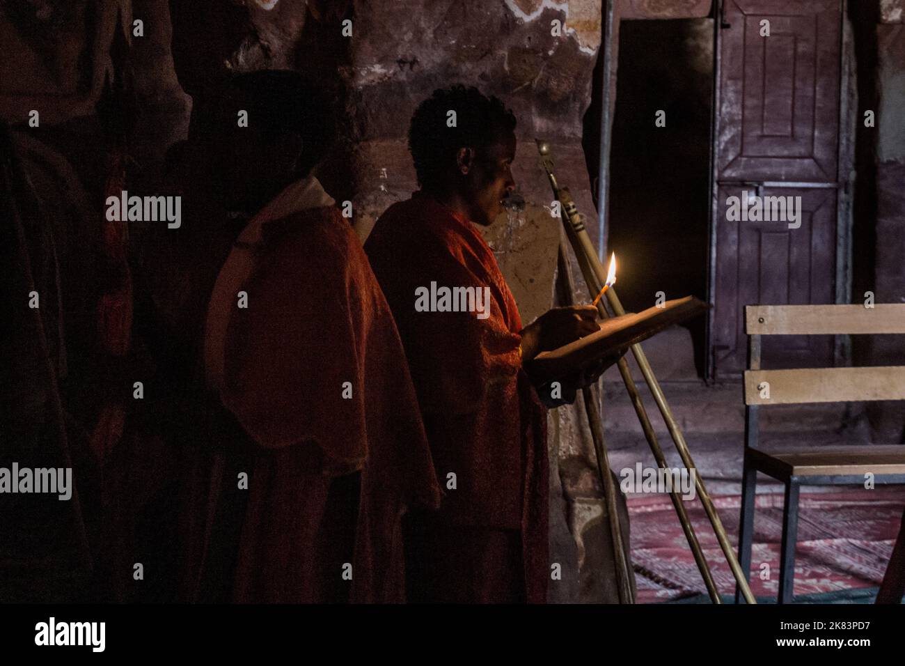 TIGRAY, ETHIOPIA - MARCH 22, 2019: Priest reading a Bible in Abuna ...