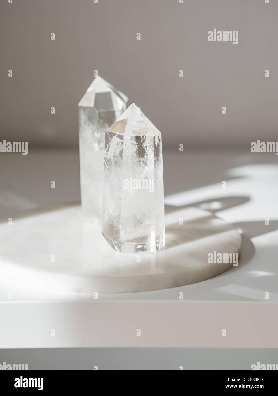 Collection of crystals quartz on a white background with shadows from ...