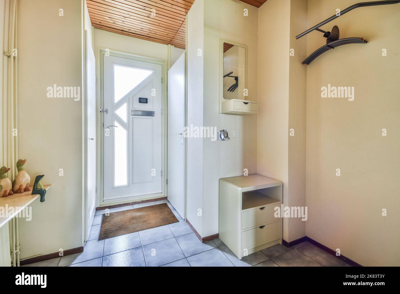 Room with door to balcony and narrow long corridor in perspective in ...