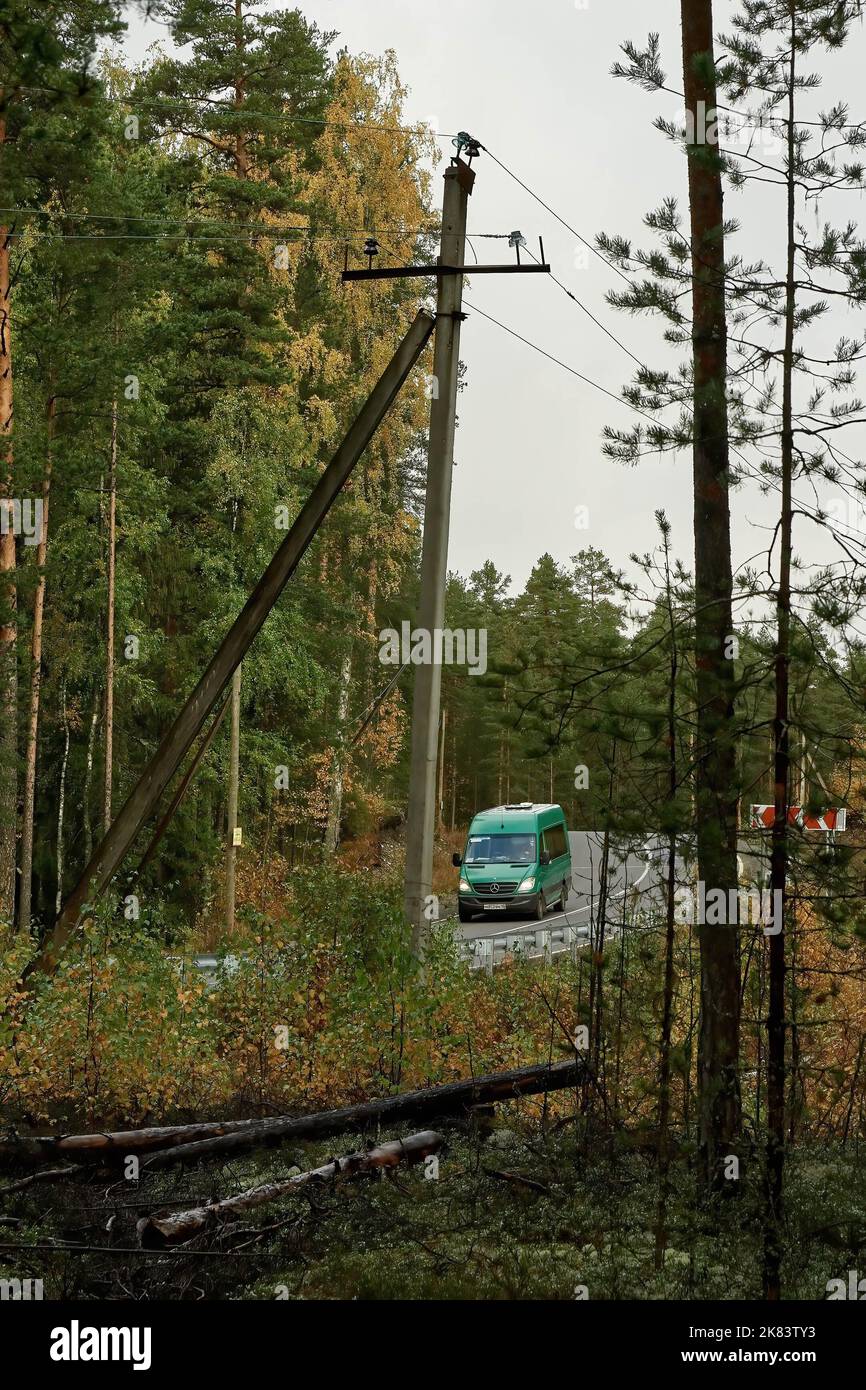 Minibus on a forest road in Karelia in autumn. The Republic of Karelia ...