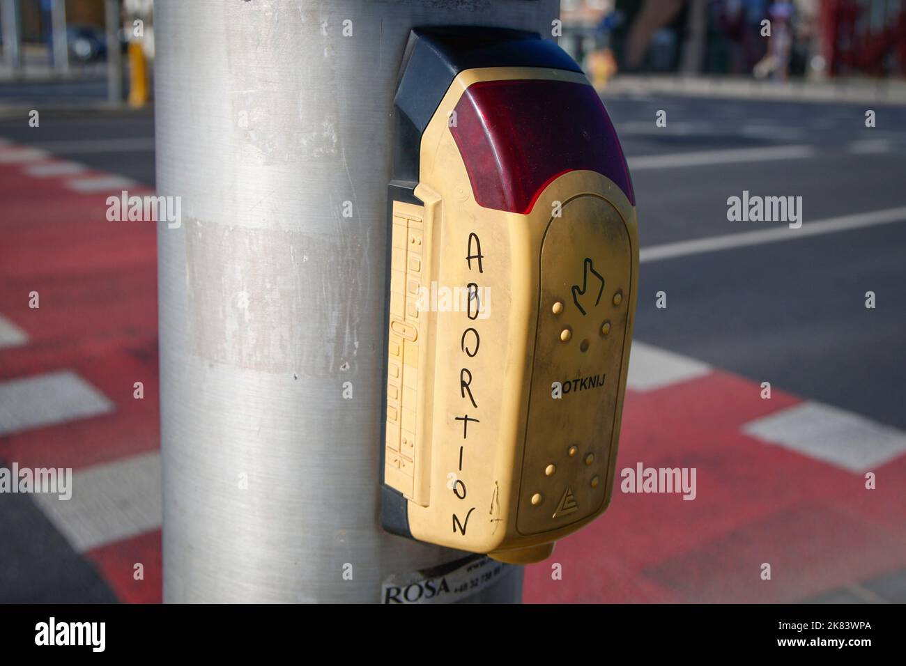 The word 'Abortion' is seen written with a marker on a crosswalk or beg ...