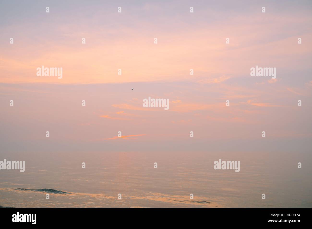 pink smoky sunset over water Stock Photo - Alamy