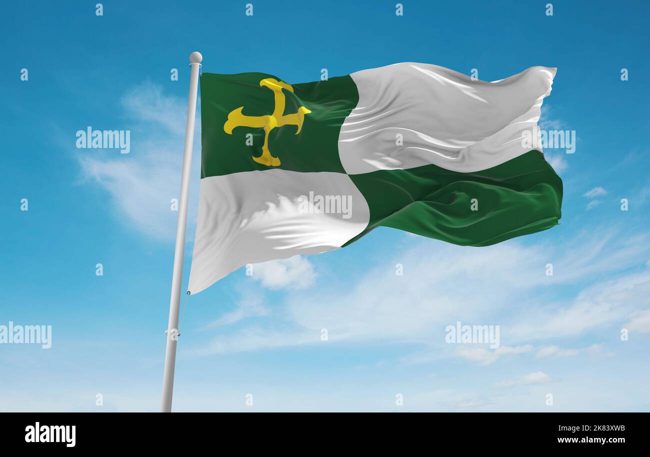 official flag of Comerio untied states of America at cloudy sky ...