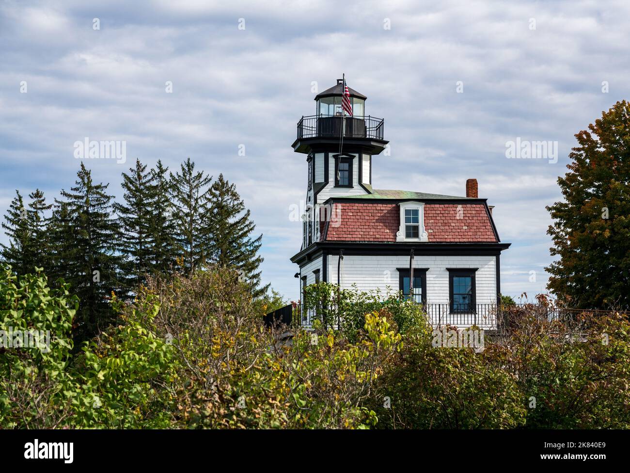 Side view of Colchester Reef Lighthouse among the trees Stock Photo - Alamy