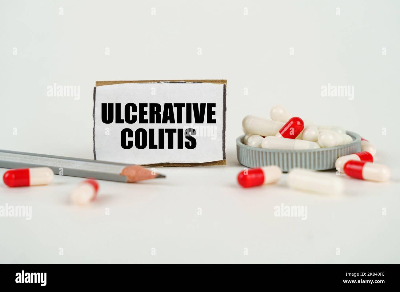 Medical concept. On a white background, medical capsules, a pencil and ...