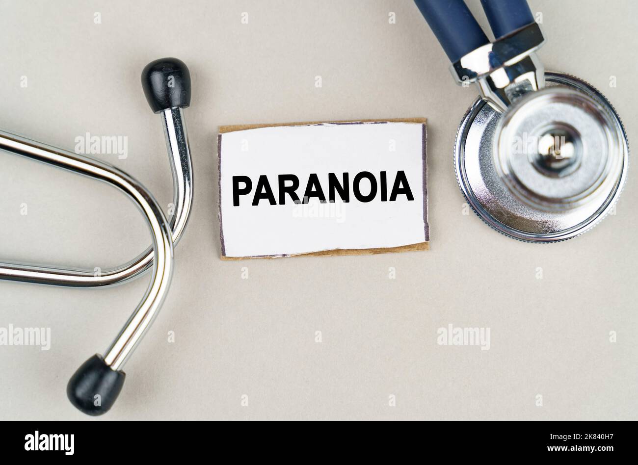 Medical concept. On a gray background, a stethoscope and a cardboard ...