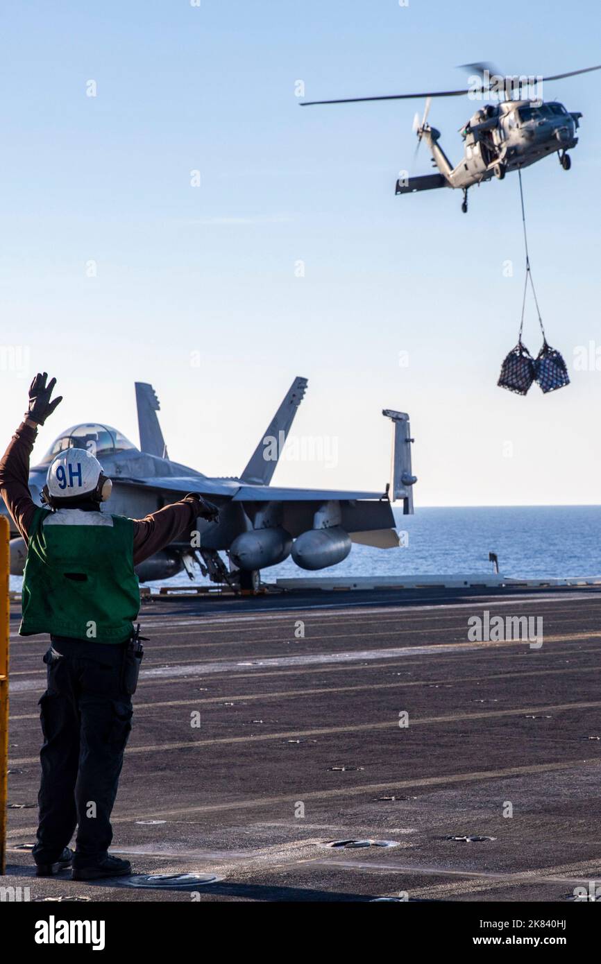 221020-N-ZG822-1236 ADRIATIC SEA (Oct. 20, 2022) A Sailor signals an MH ...