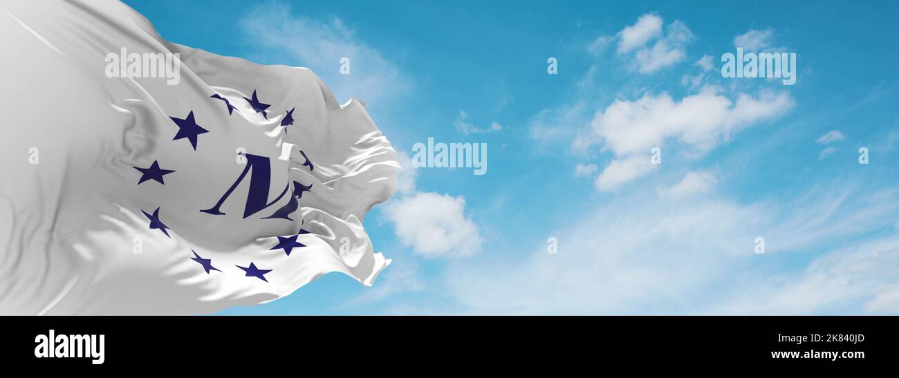 official flag of Madrid, Iowa untied states of America at cloudy sky ...