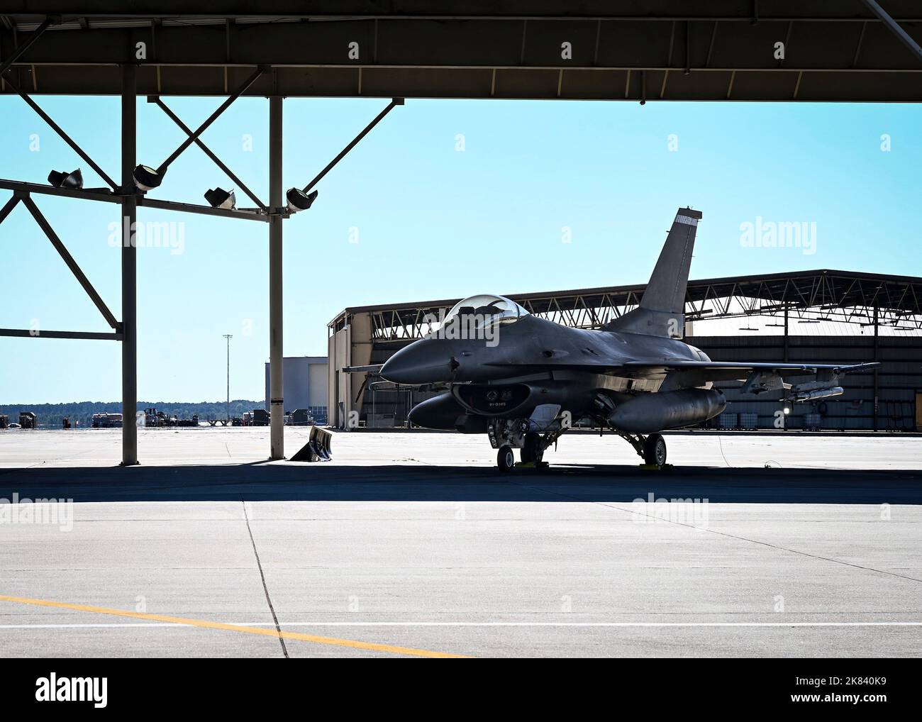 A 55th Fighter Squadron (55th FS) F-16C Fighting Falcon sits below a ...