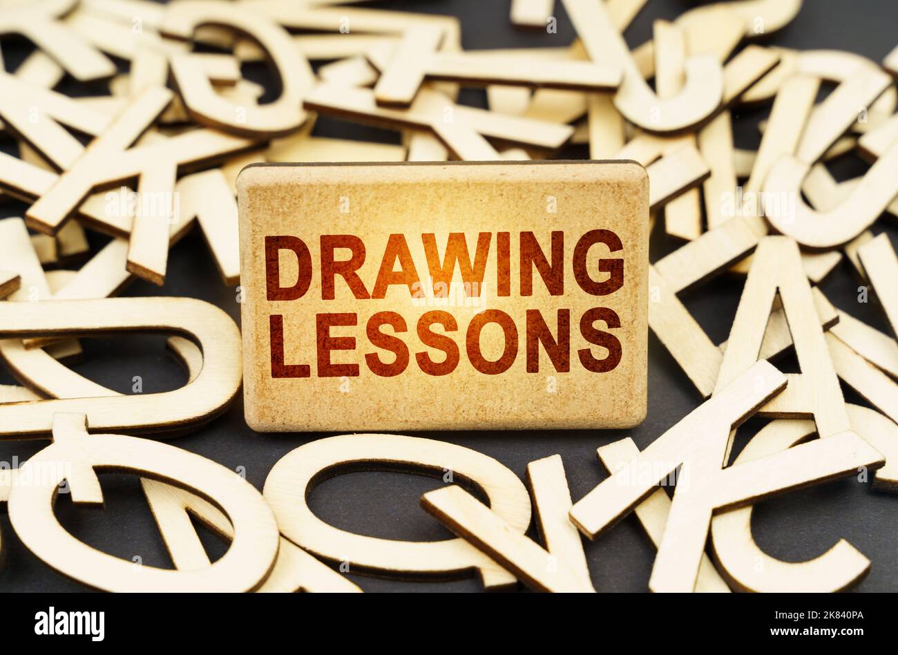 Education concept. Among the wooden letters is a sign with the ...