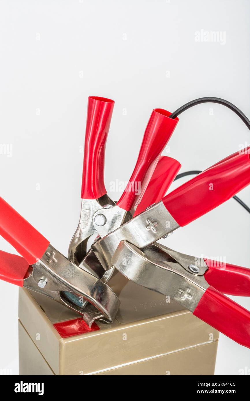 Overloaded cluster of red positive / +'ve battery terminal crocodile ...