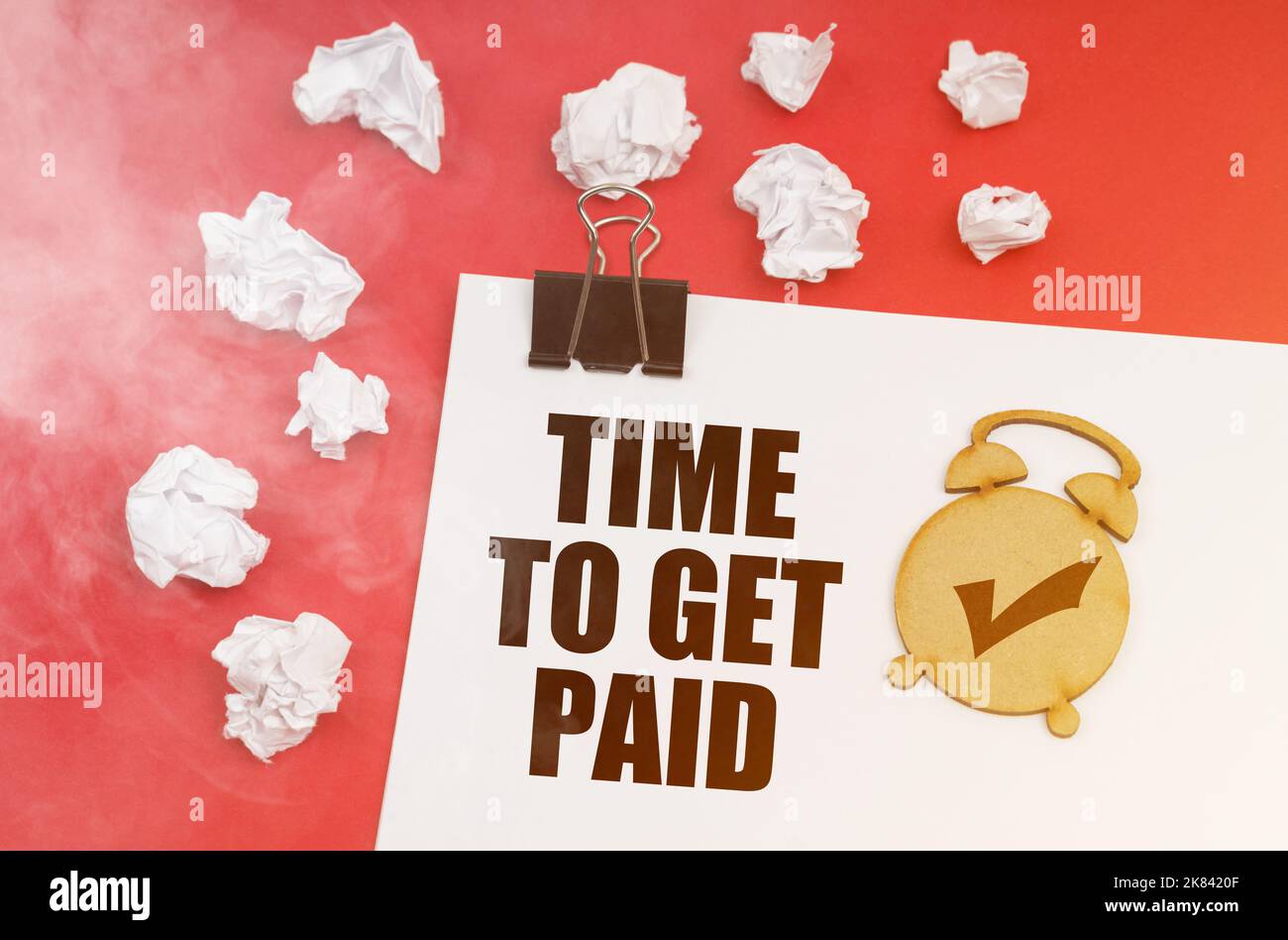 Business and finance concept. On a red background in smoke, crumpled ...