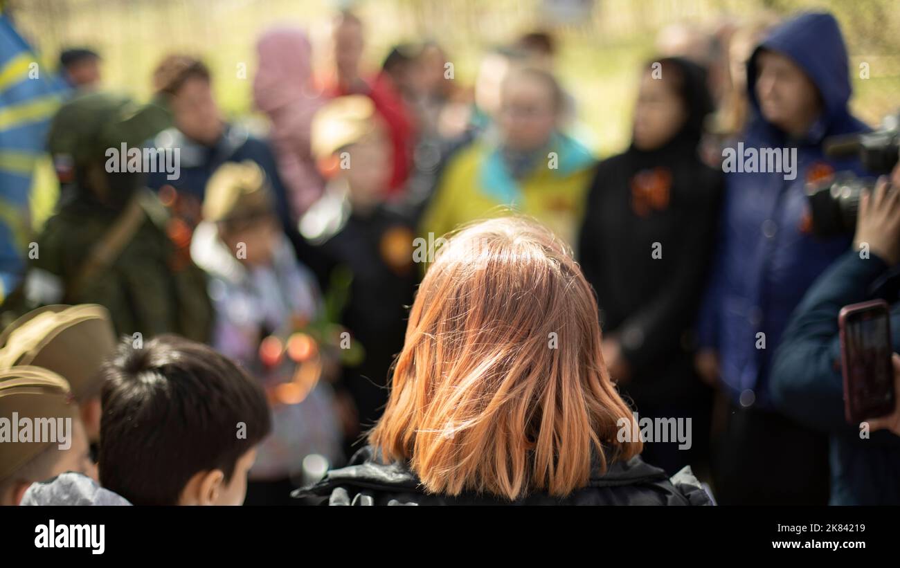 Girl at funeral ceremony in Russia. People at Tomb of Unknown Soldier ...