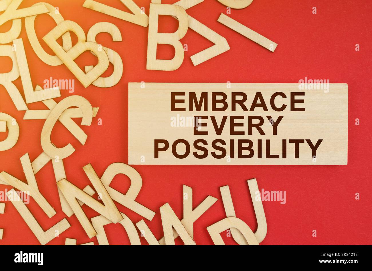 Business and finance concept. On a red background, there are wooden ...