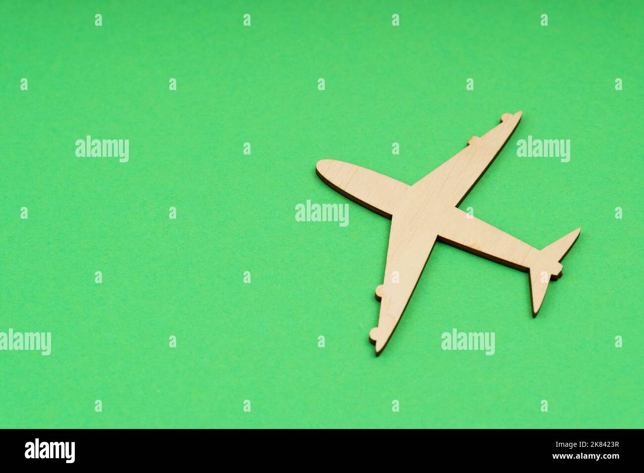 Environmental concept. The wooden airplane flies up. Isolated on a ...