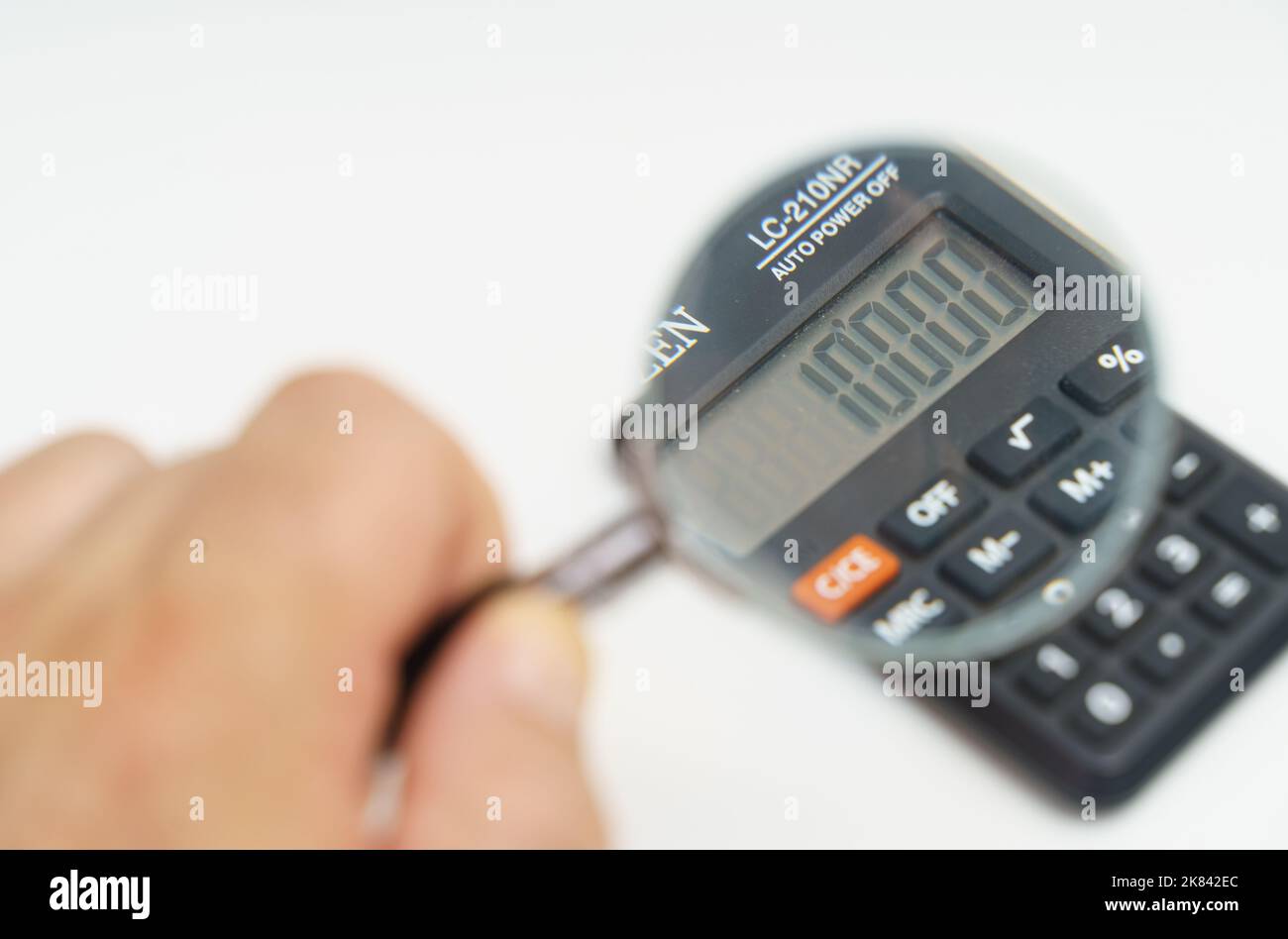 Business and finance concept. The magnifying glass looks at the ...