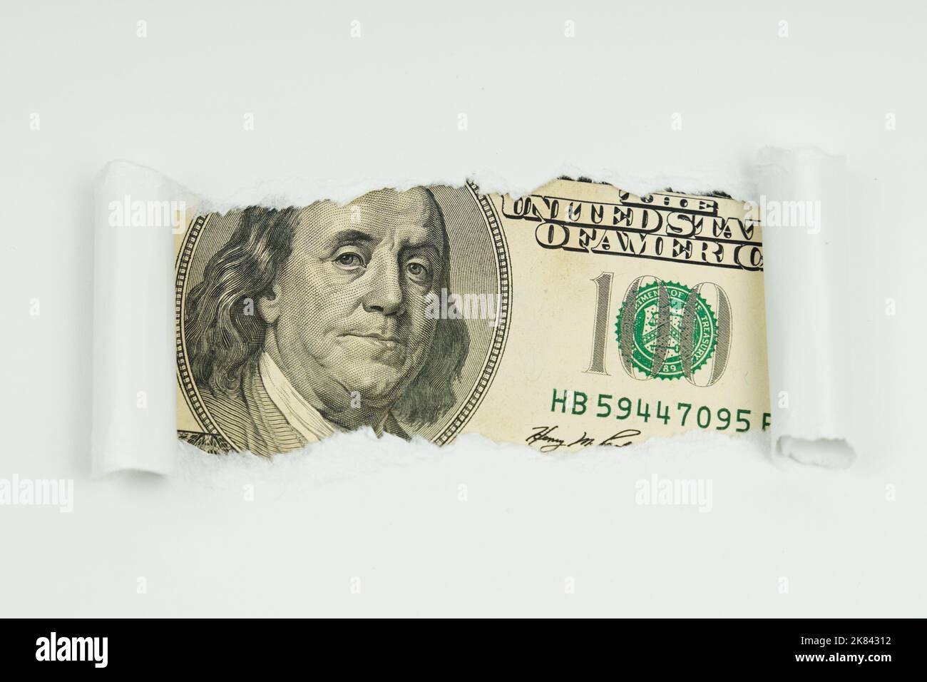 Business and finance concept. An image of a 100 dollar bill is visible ...