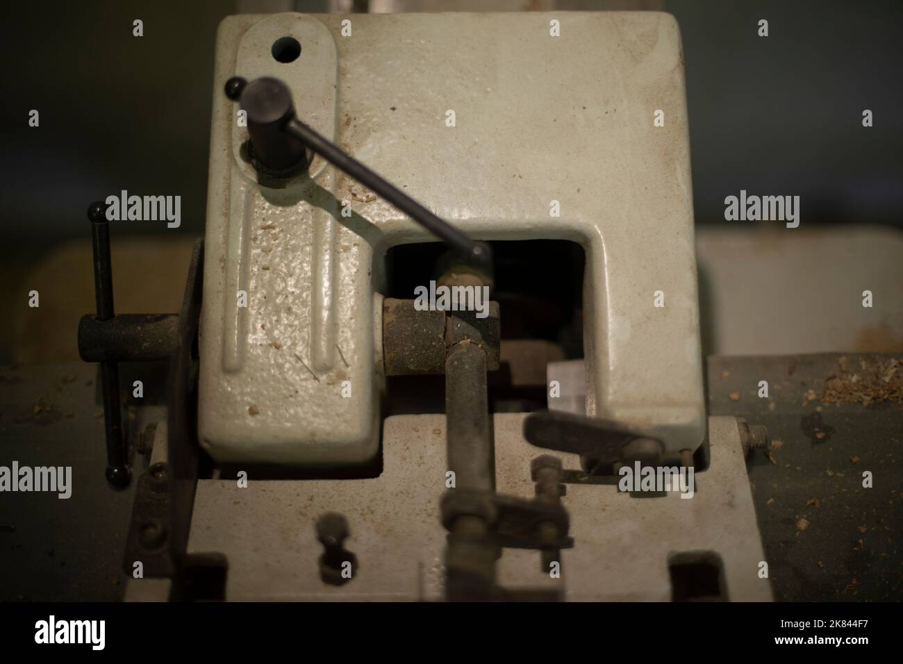 Iron lever mechanism. Old thing in garage. Steel block with lever ...