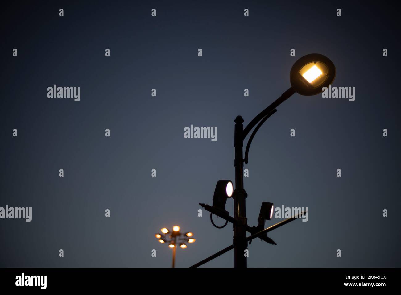 Pole with lamp in city. City light. Outdoor lighting fixture. Details ...