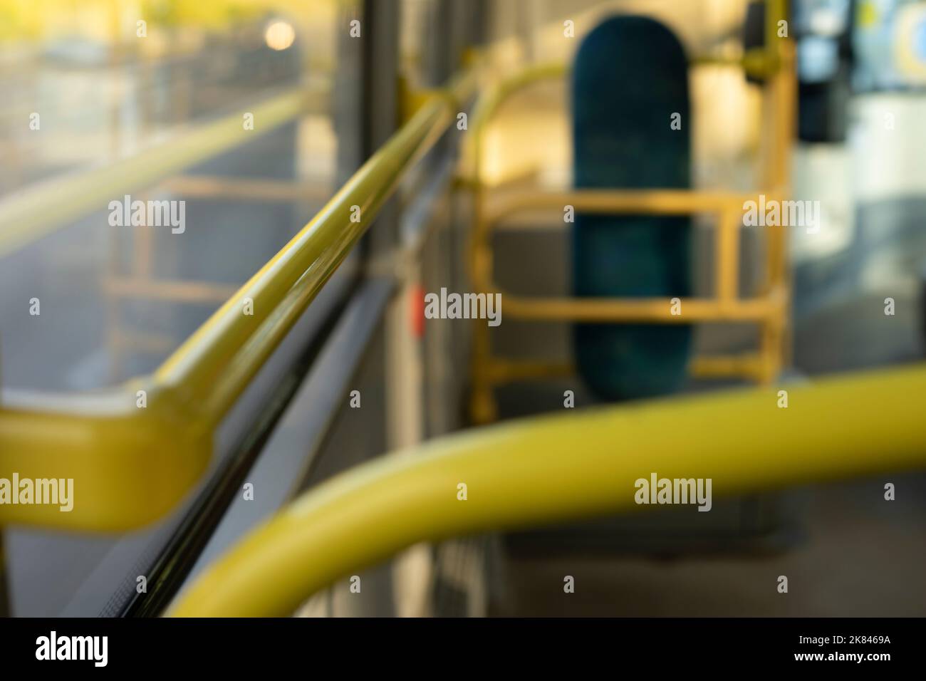 Interior of bus. Yellow handrail in transport. Public transport inside ...
