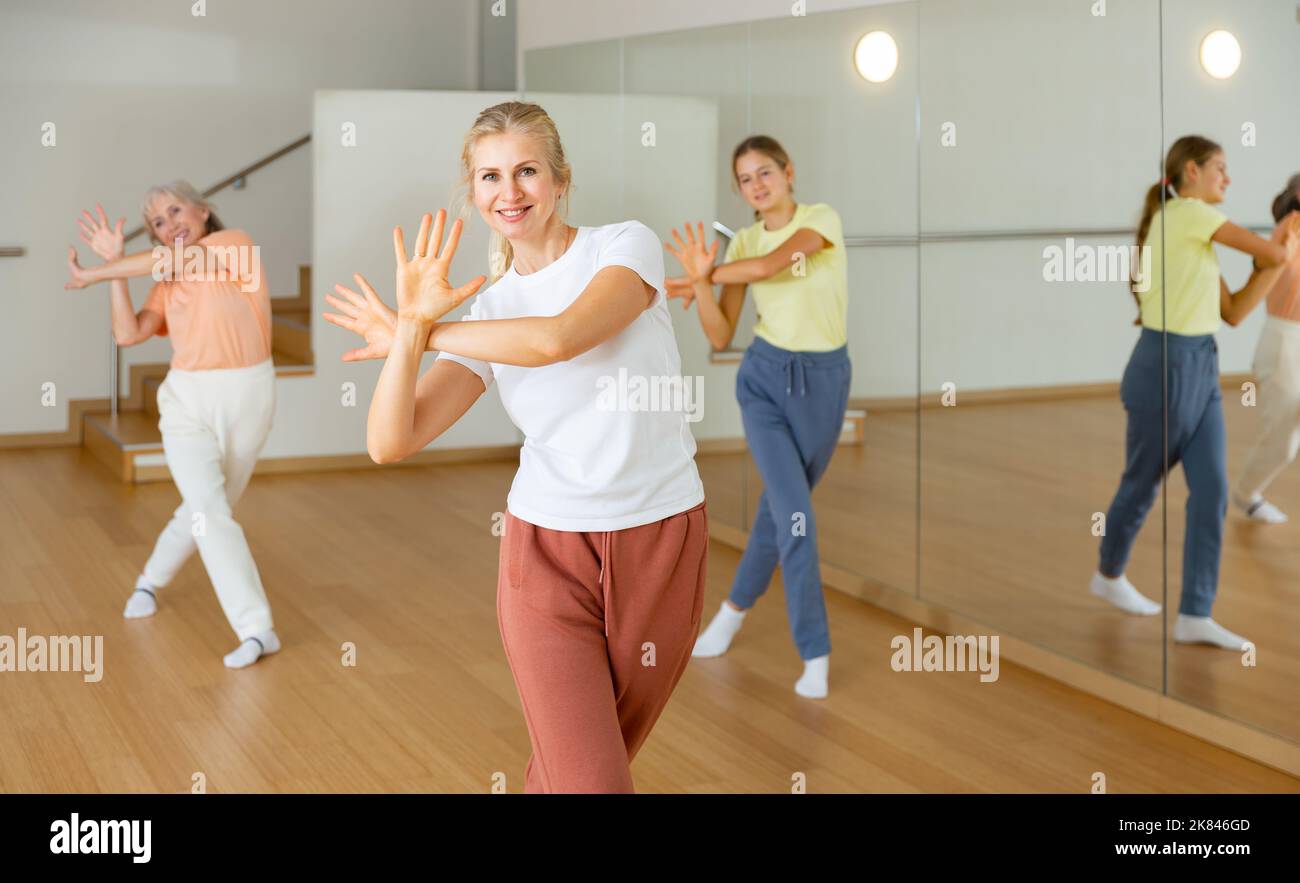 Female doing dance workout during group classe in fitness center Stock ...