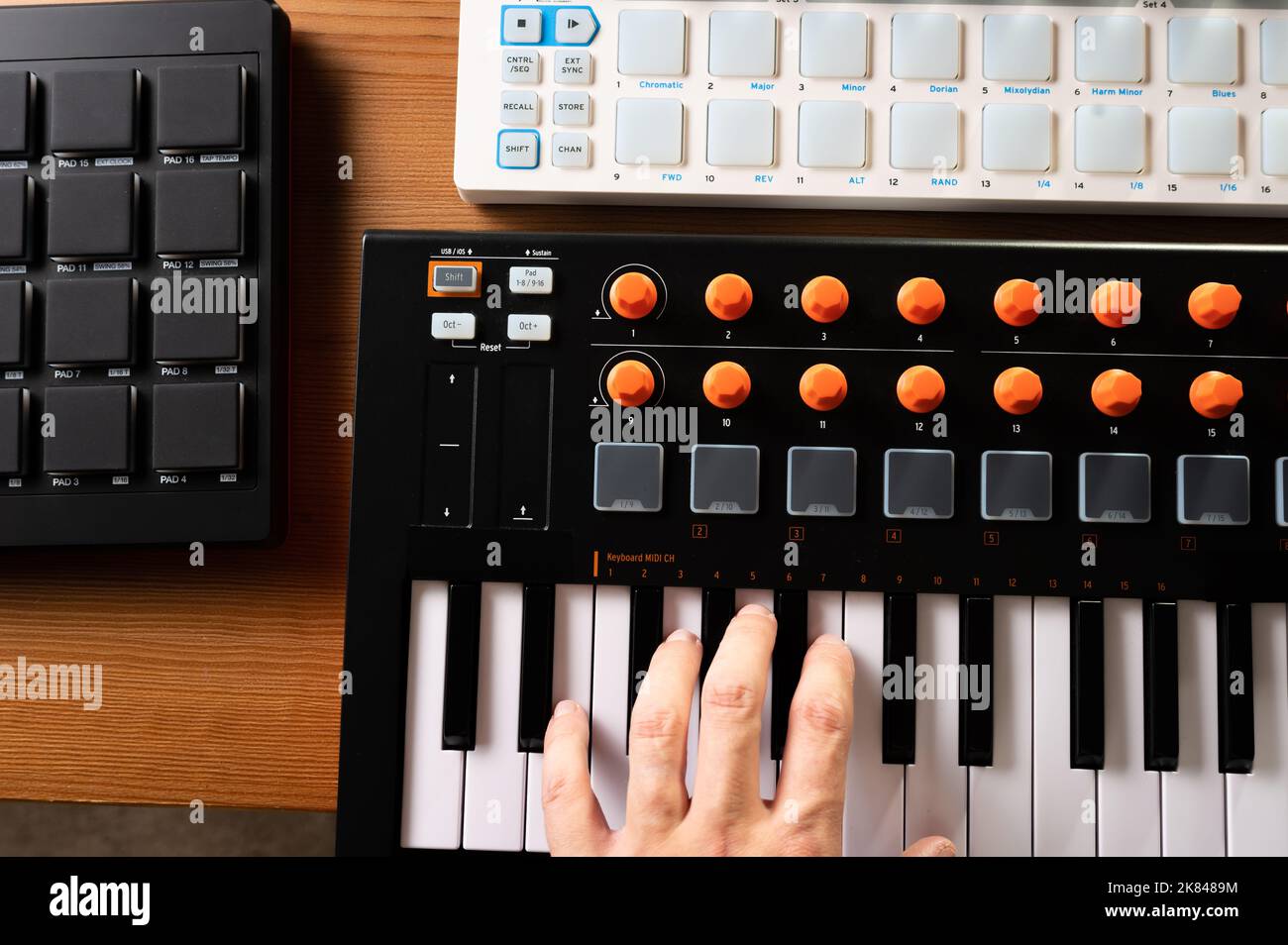 Musician's hand on midi keyboard. Modern musical equipment for ...