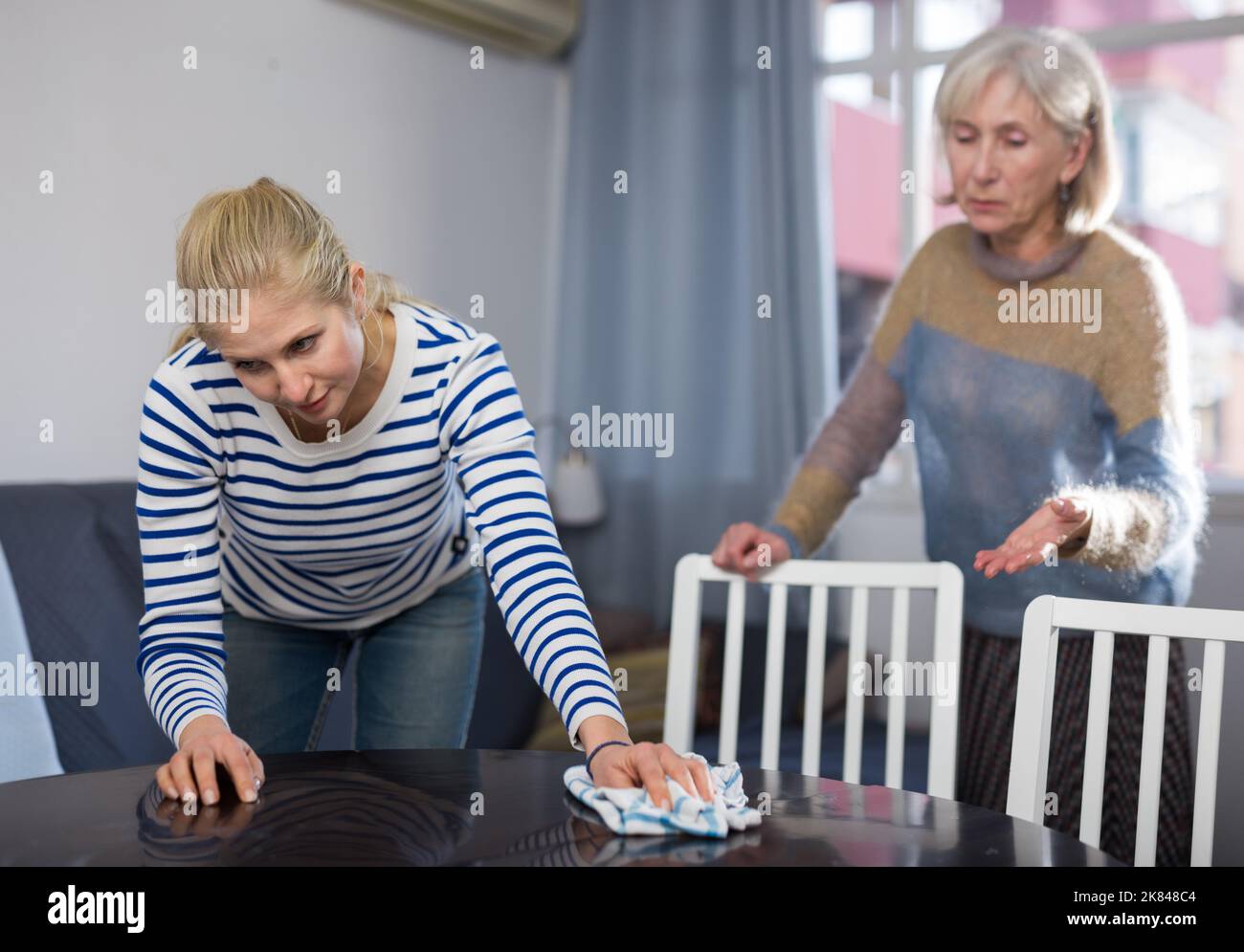 Mature woman scolds her adult daughter Stock Photo - Alamy