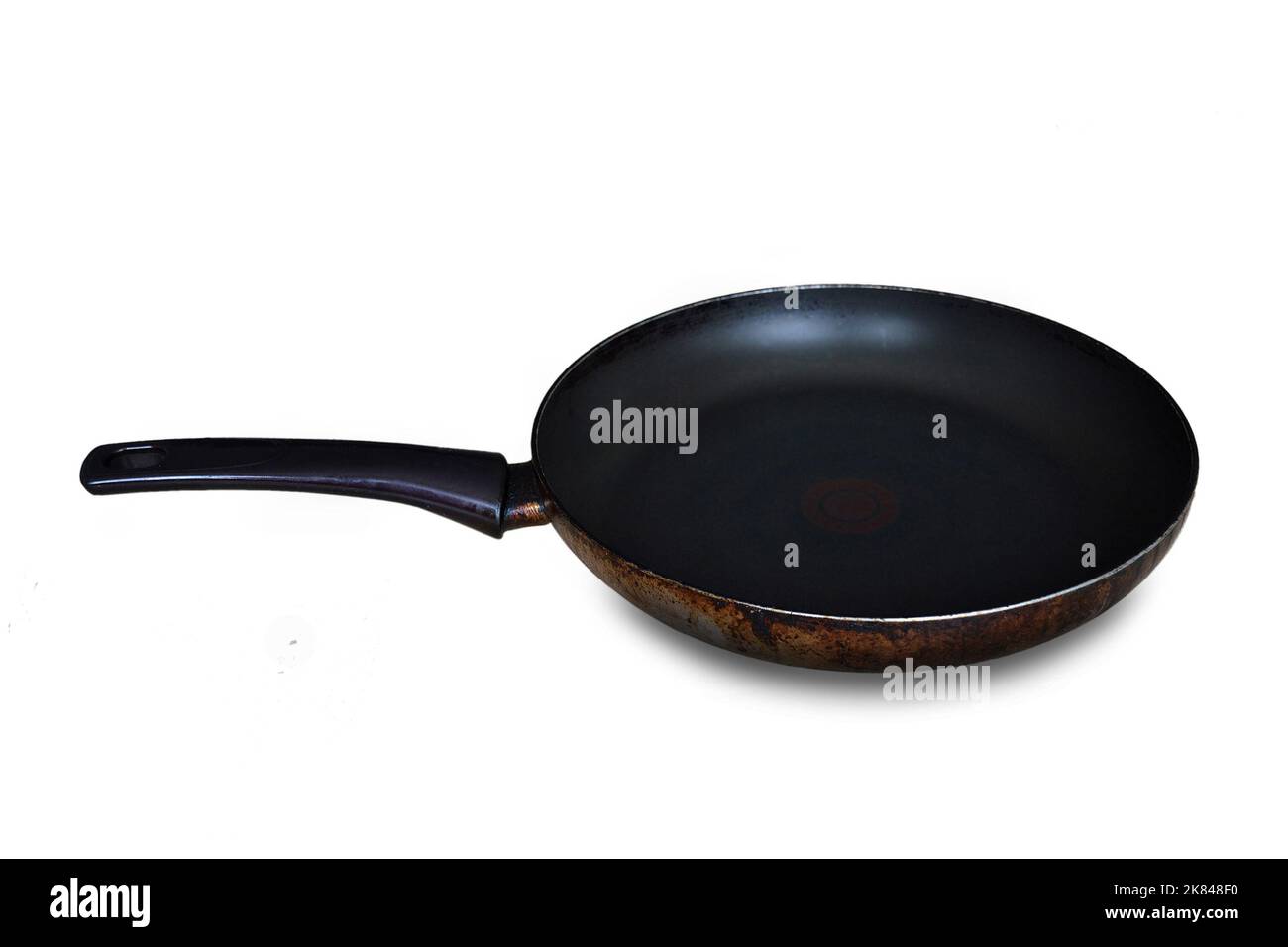 Old and dirty frying pan isolated on white background Stock Photo - Alamy